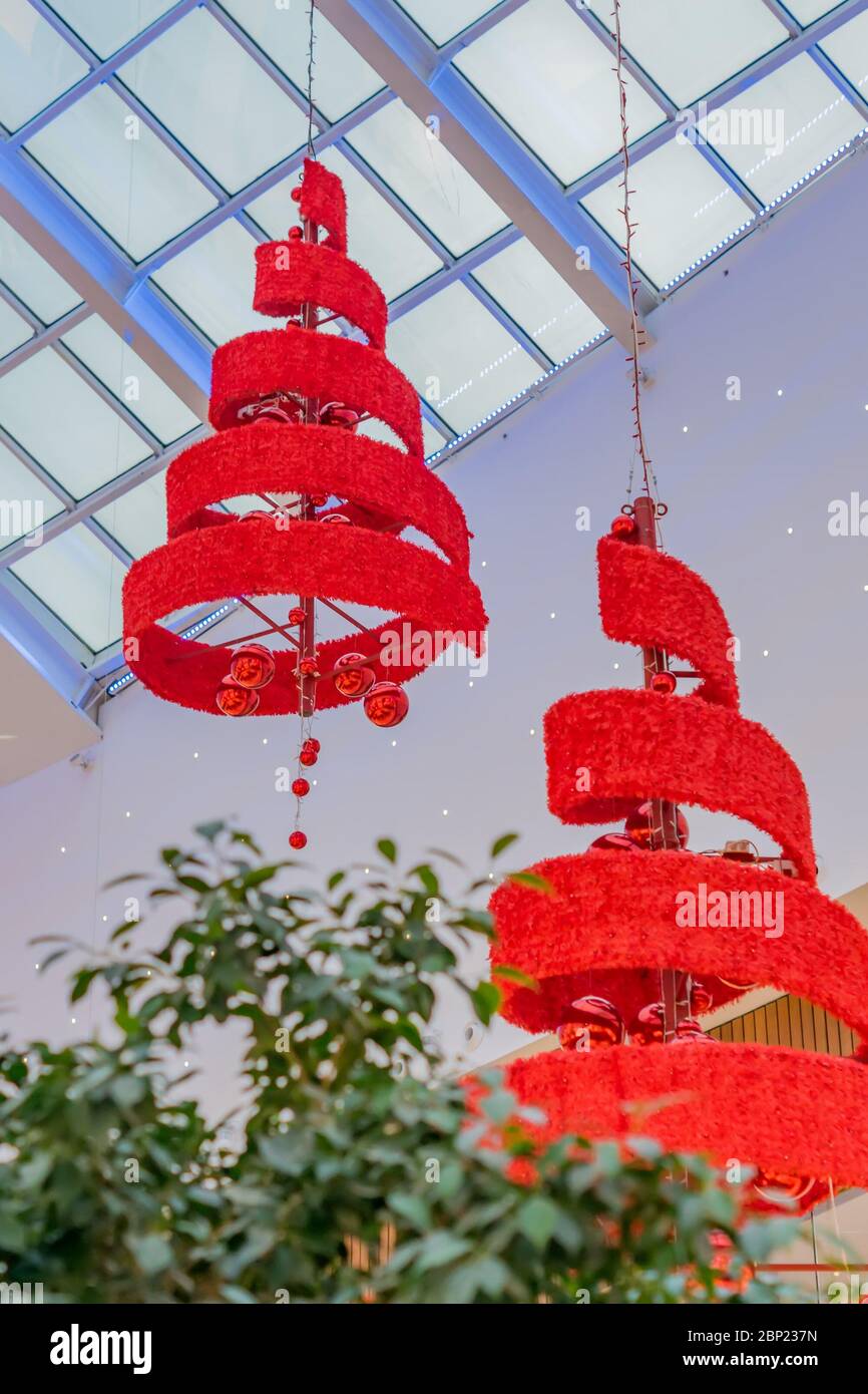 red xmas tree and garland hanging on ceiling closeup Stock Photo - Alamy