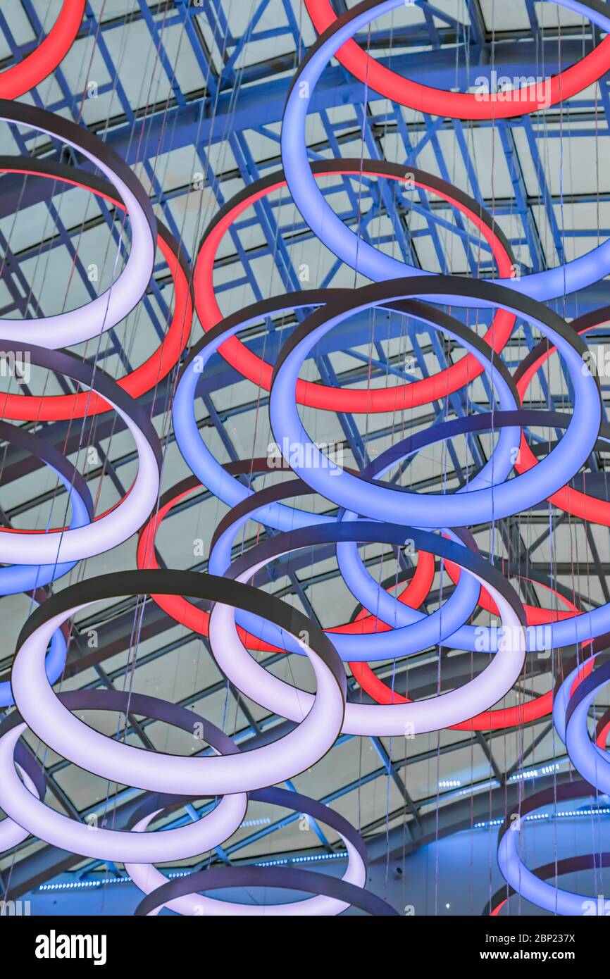 Ceiling inside shopping mall decorated with round colorful lamps Stock ...