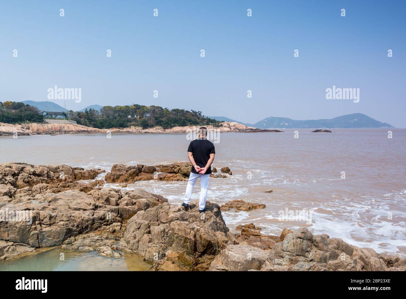 Tourist at the seaside at Mount Luojia, which lies in the Lotus Sea to ...