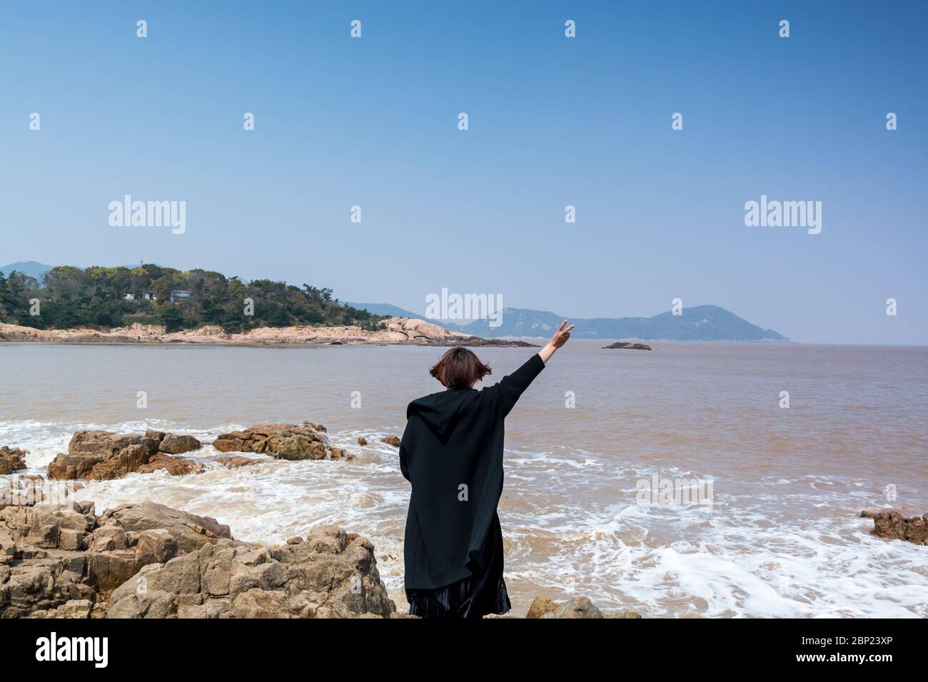 Tourist at the seaside at Mount Luojia, which lies in the Lotus Sea to ...