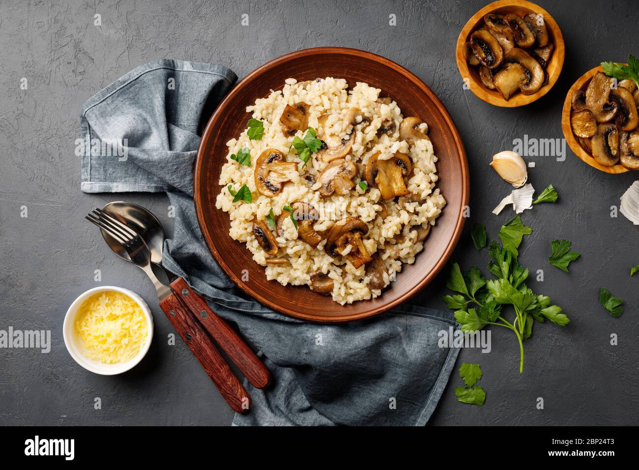 A dish of Italian cuisine - risotto from rice and mushrooms in a brown ...
