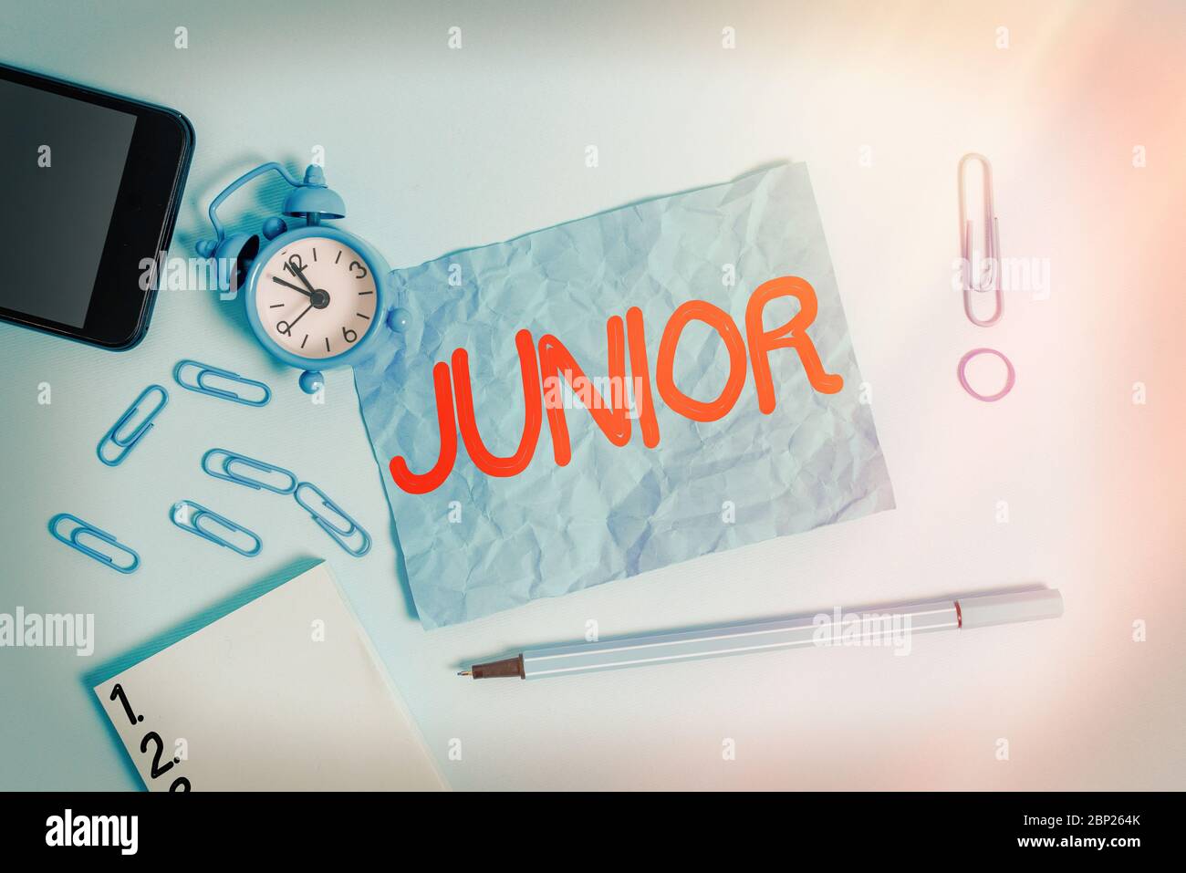 Conceptual hand writing showing Junior. Concept meaning erson who is a ...