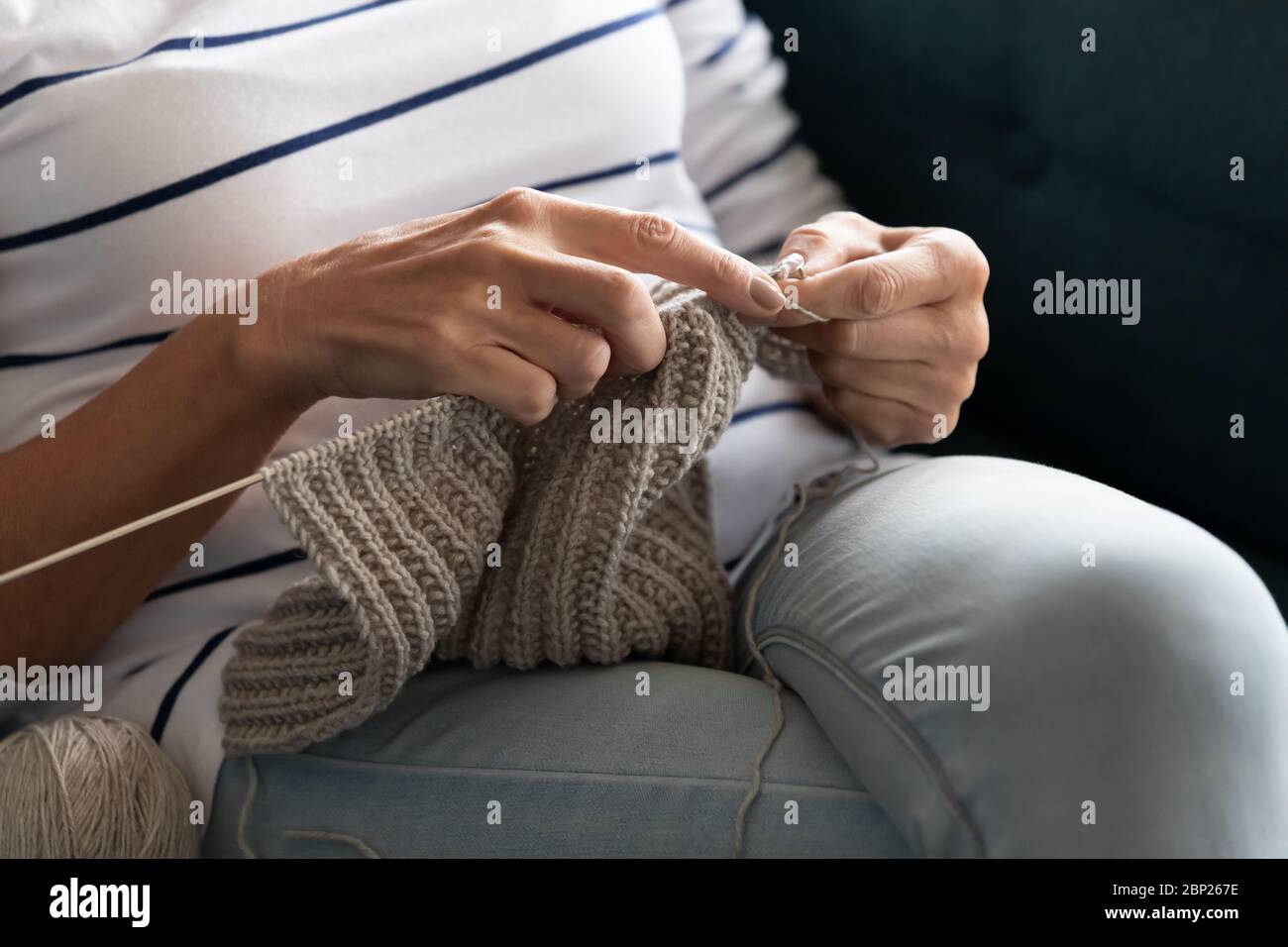 Close up middle aged mature woman knitting handmade warm sweater Stock ...