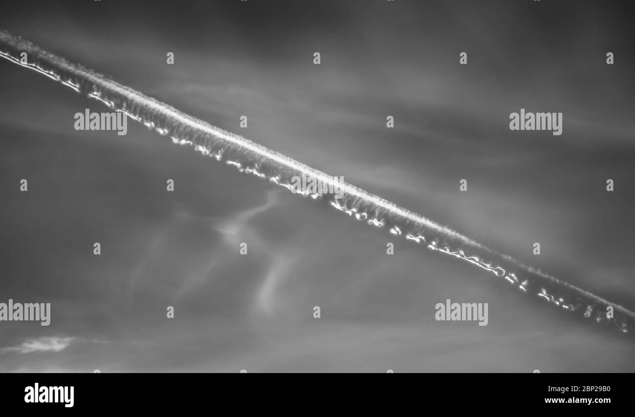 Contrail that looks like handwriting Stock Photo - Alamy