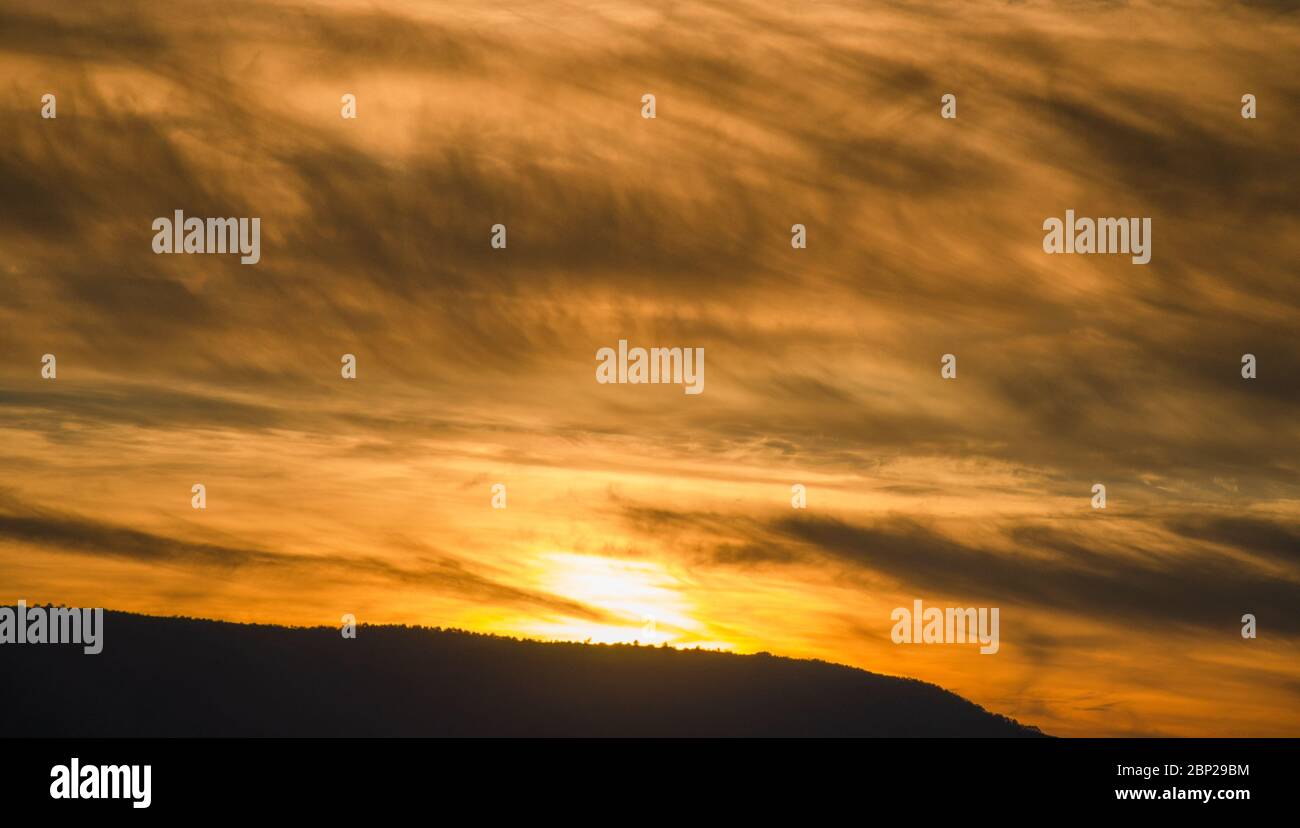 Crazy sunset clouds Stock Photo - Alamy