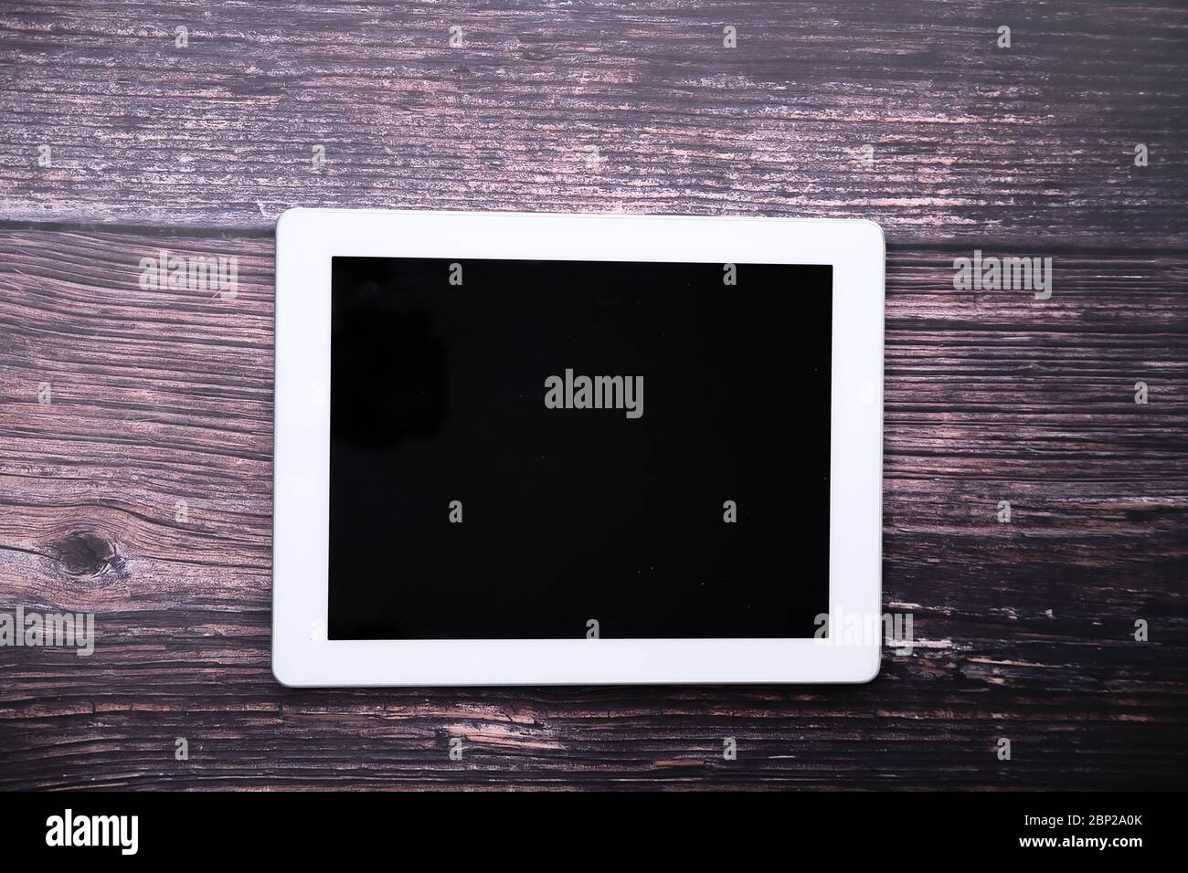 Top view of digital tablet with screen on wooden desk Stock Photo - Alamy