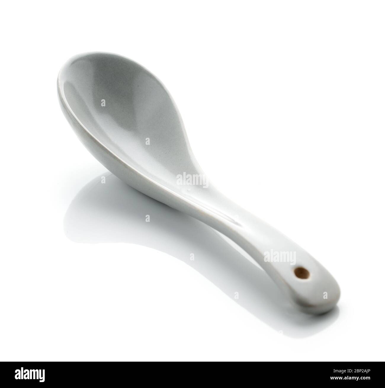 grey color empty asian spoon isolated on white background Stock Photo ...