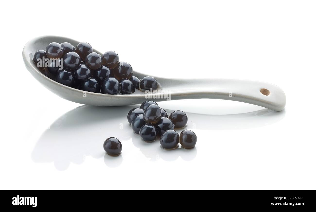 Spoon of black tapioca pearls for bubble tea isolated on white ...