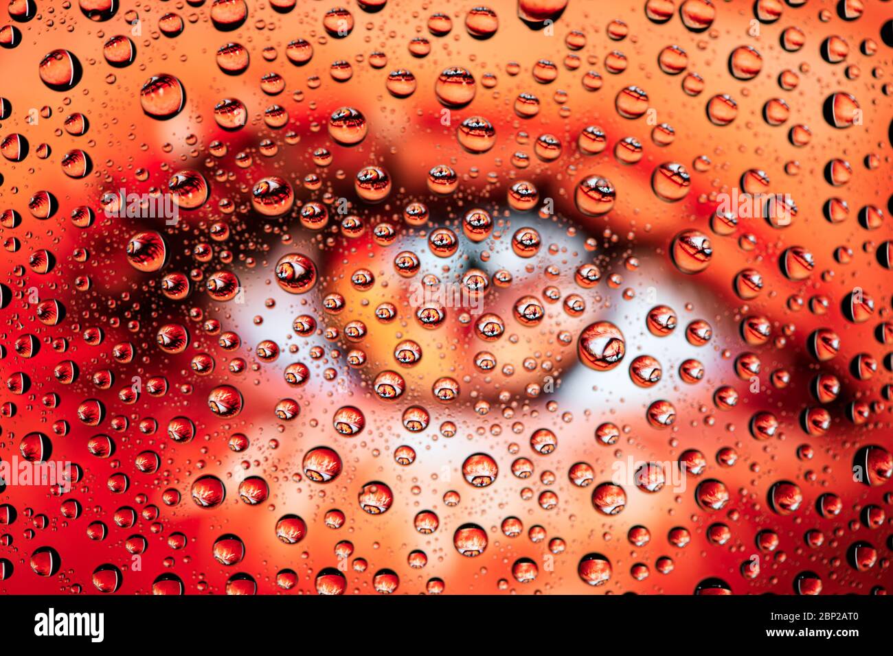 Female eye through drops of water on glass Stock Photo - Alamy