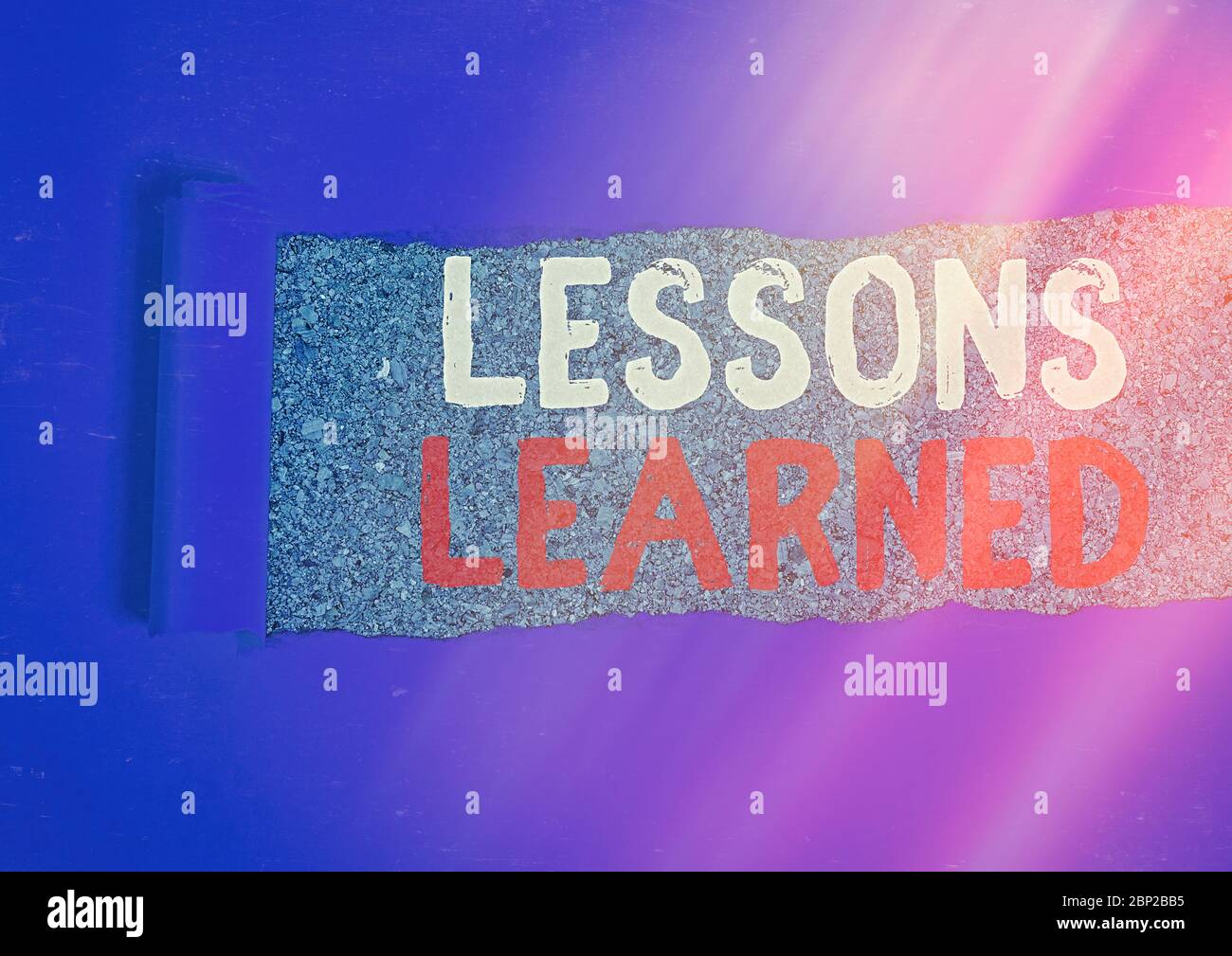 Writing note showing Lessons Learned. Business concept for experiences distilled project that ...