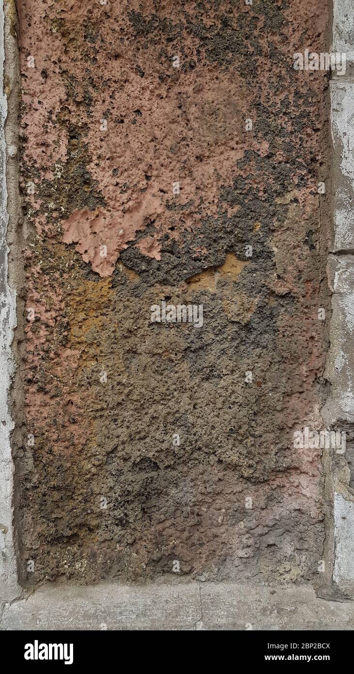 Dilapidated dirty wall texture closeup with damaged rough brown stucco ...