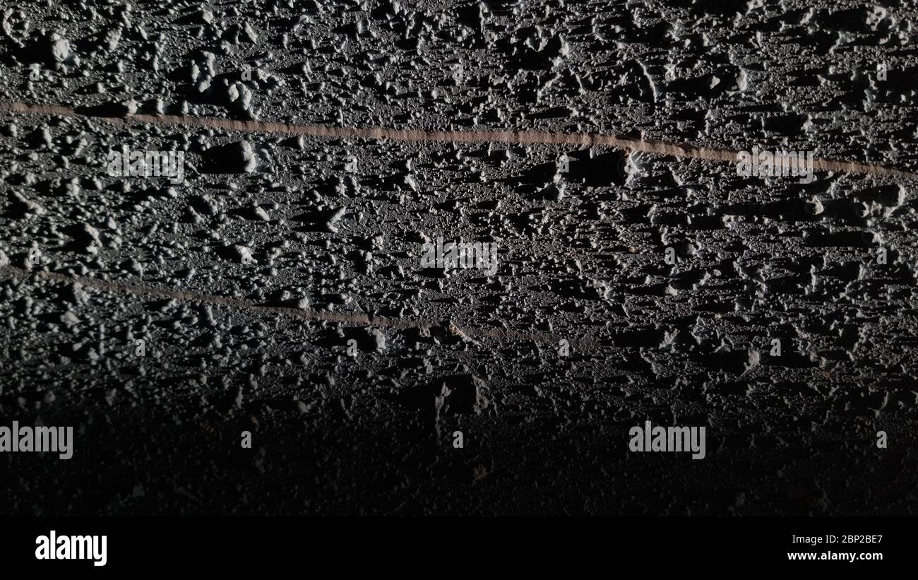 Scratched rough texture of dark wall surface closeup. Straight line of ...