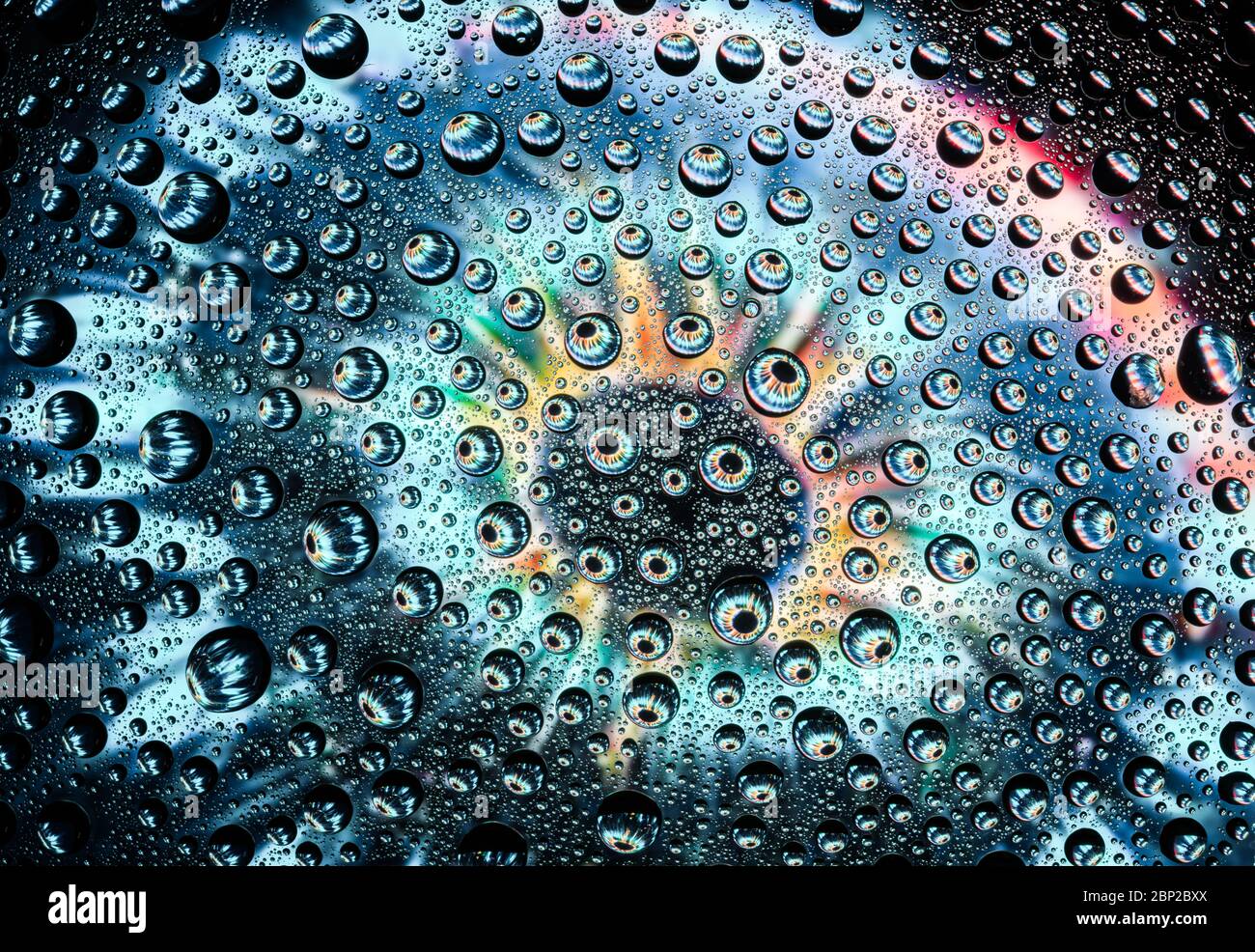 human eye close-up through drops of water on glass Stock Photo - Alamy
