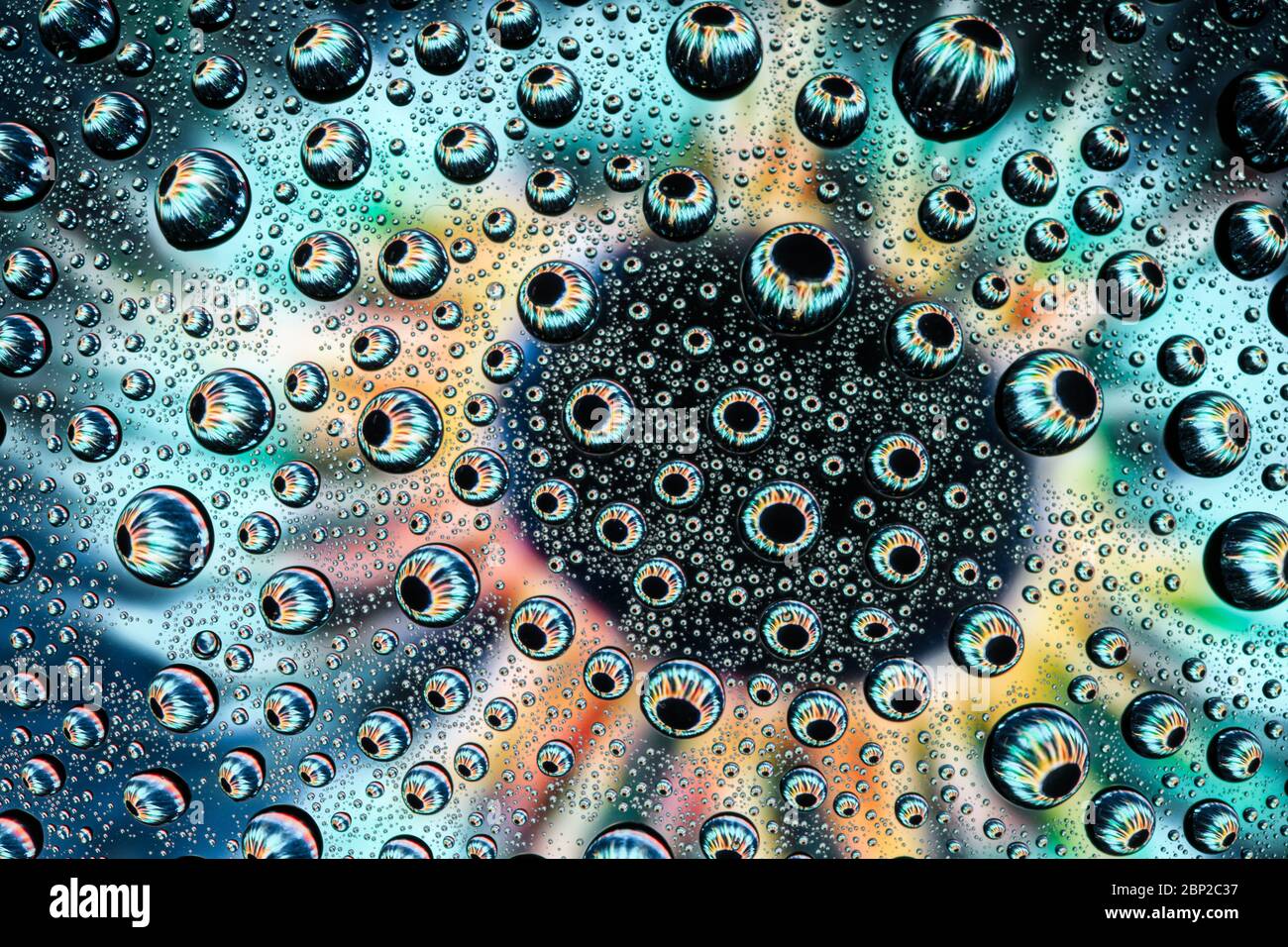 human eye close-up through drops of water on glass Stock Photo - Alamy