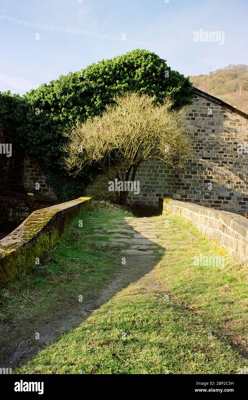 End of the road, a pathway that ends at an old stone house in the ...