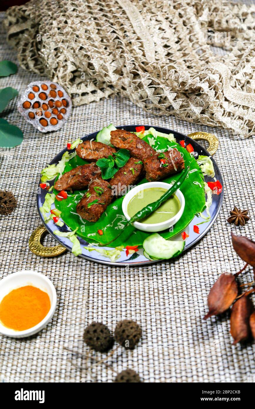 Traditional Asian dish named kebab with vegetable sauce and spices on a ...