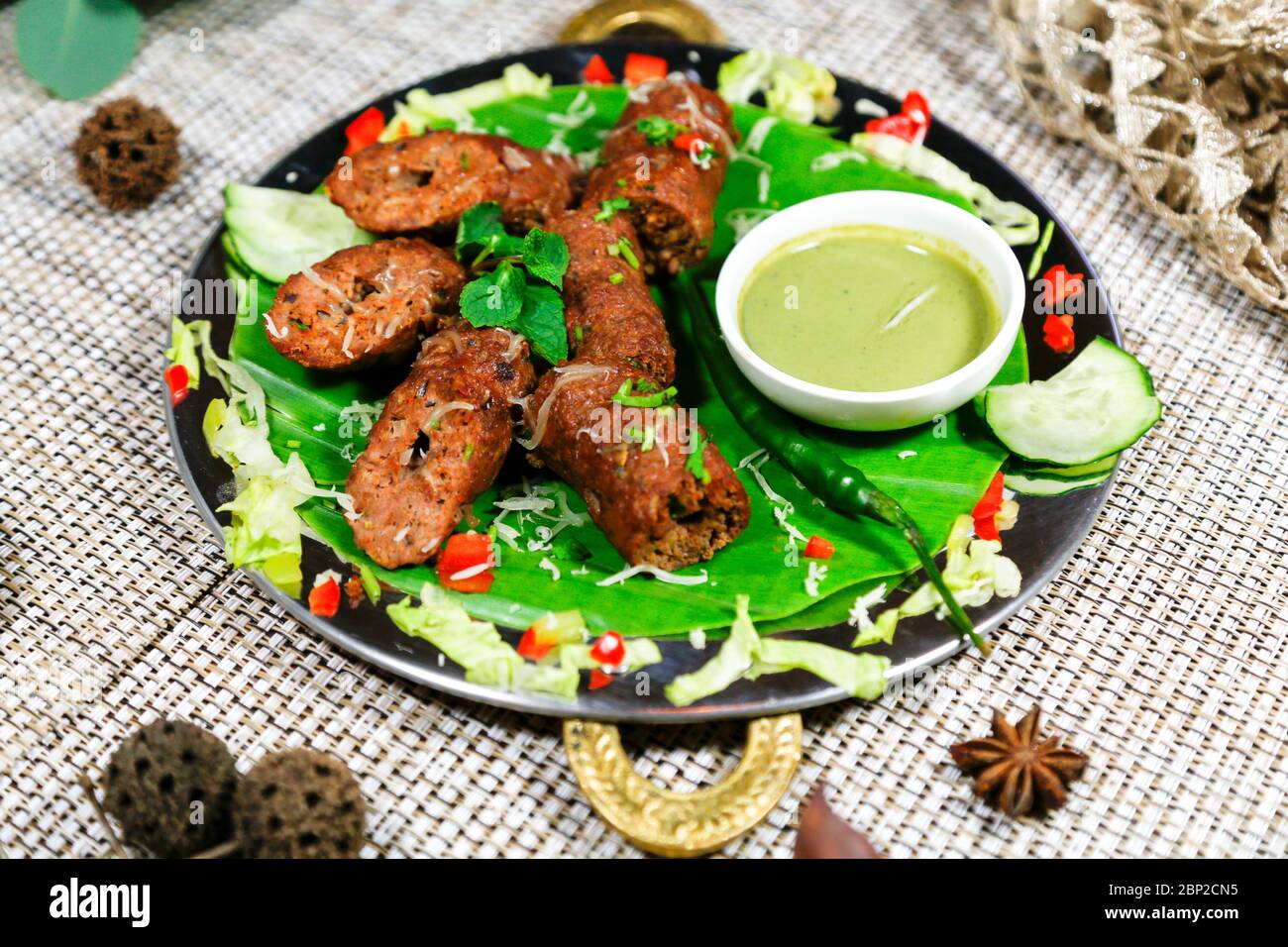 Traditional Asian dish named kebab with vegetable sauce and spices on a ...