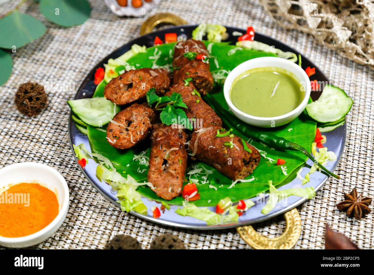 Traditional Asian dish named kebab with vegetable sauce and spices on a ...