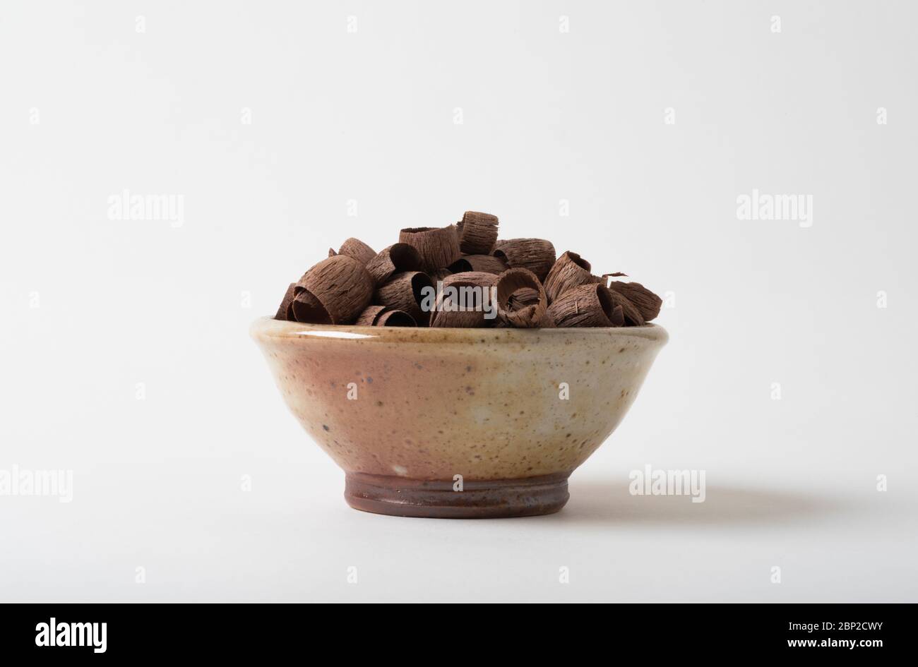 collection of walnut shavings from carving, collected in a small ...