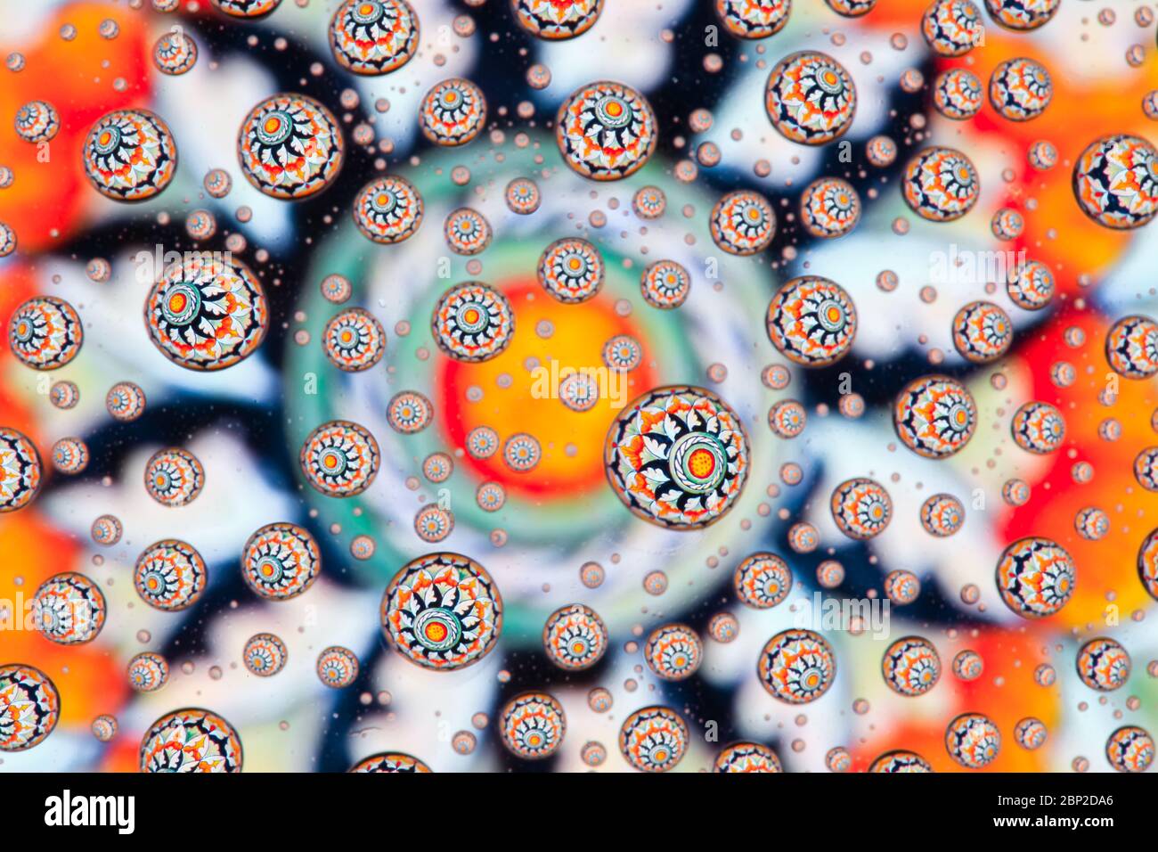 multi-colored mandala through drops of water on glass Stock Photo - Alamy