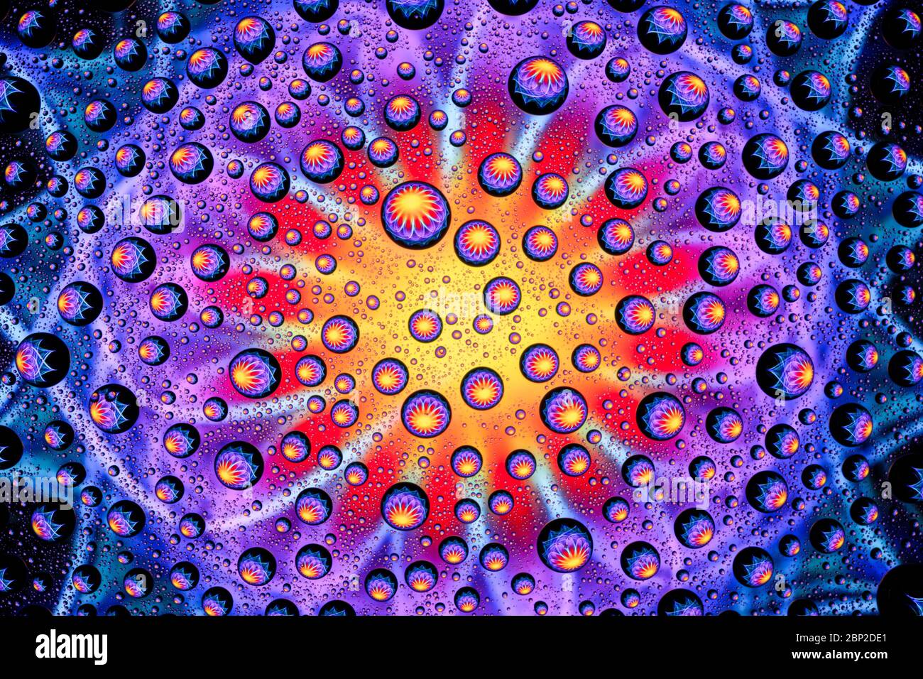 multi-colored mandala through drops of water on glass Stock Photo - Alamy