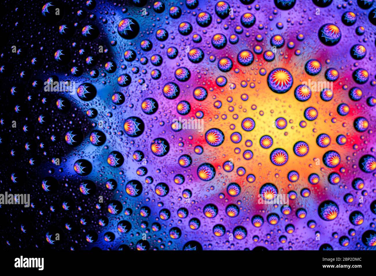 multi-colored mandala through drops of water on glass Stock Photo - Alamy