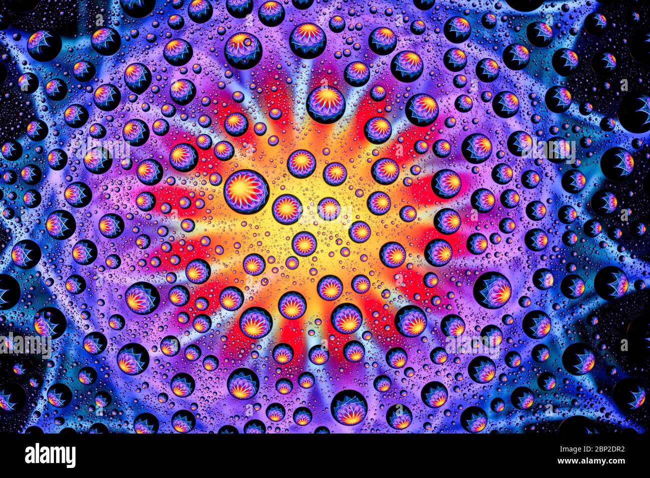 multi-colored mandala through drops of water on glass Stock Photo - Alamy