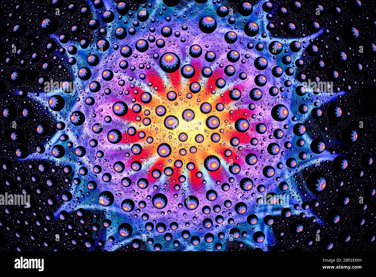 multi-colored mandala through drops of water on glass Stock Photo - Alamy