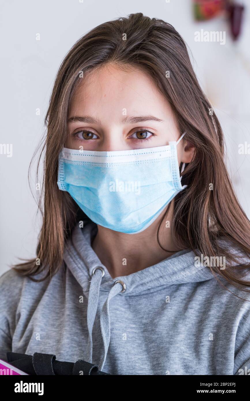 12-year-old girl wearing a protective mask during the Covid 19 pandemic ...