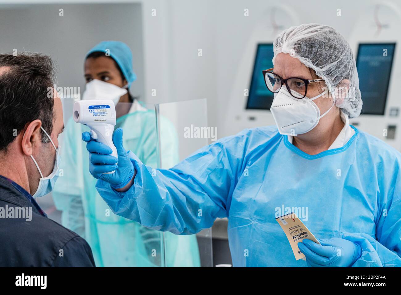 Patient temperature measurement with a forehead thermometer at the ...