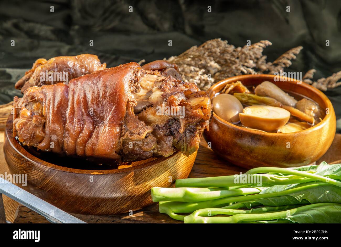 Chinese traditional dish Stewed pork leg with boiling sweet gravy sauce ...