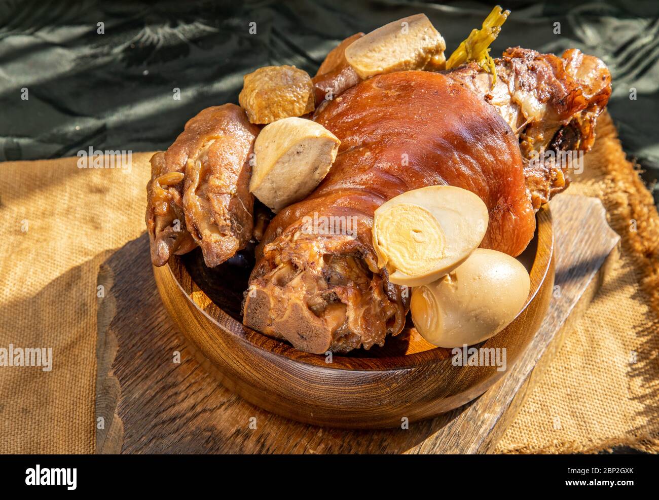 Chinese traditional dish stewed pork leg with boiling sweet gravy sauce ...