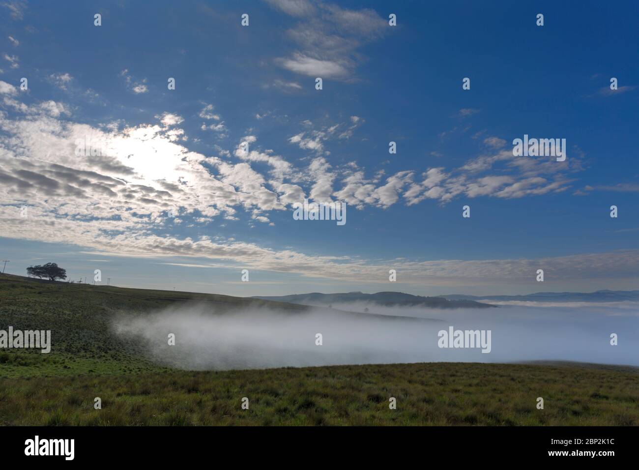 Wind blow mist up the valley Stock Photo - Alamy