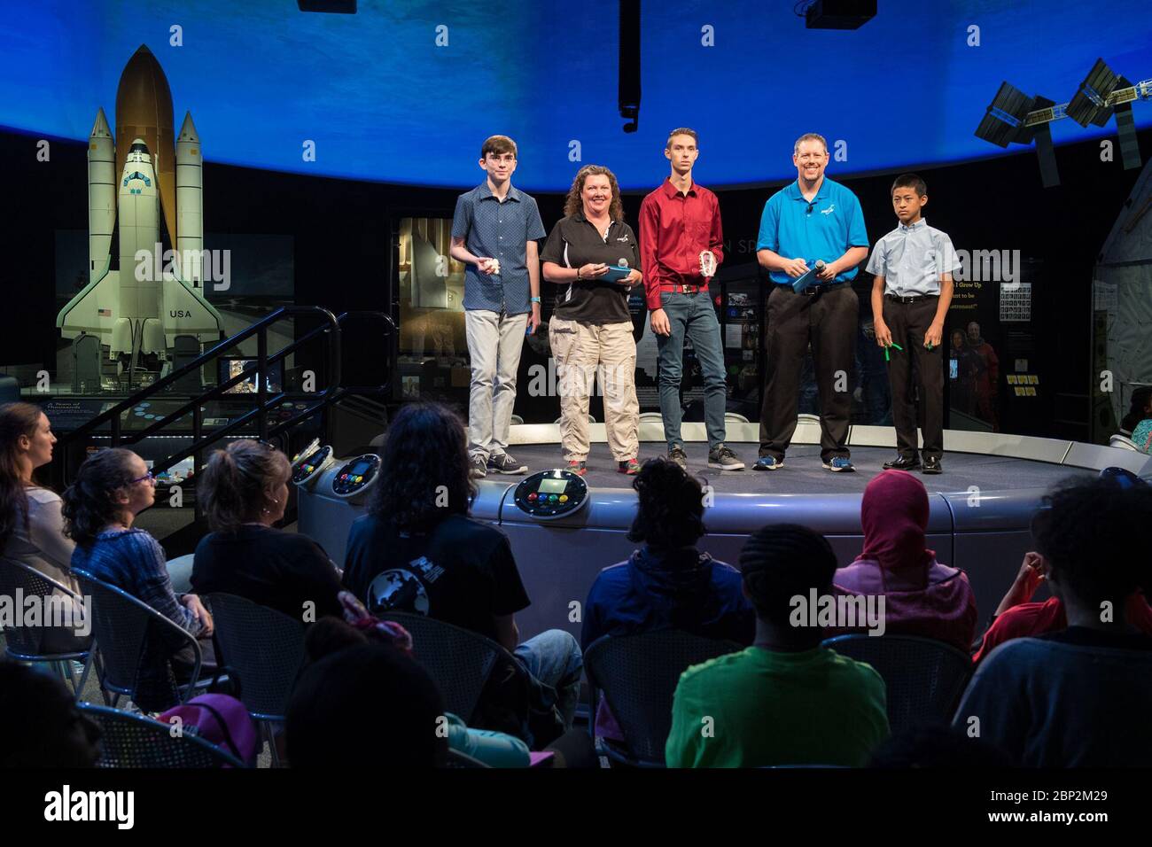 Astronaut Serena Aun-Chancellor interacts with winners Ansel Austin ...