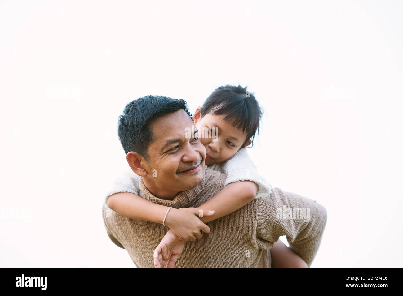 Portrait of asian father carrying his daughter on his back Stock Photo ...
