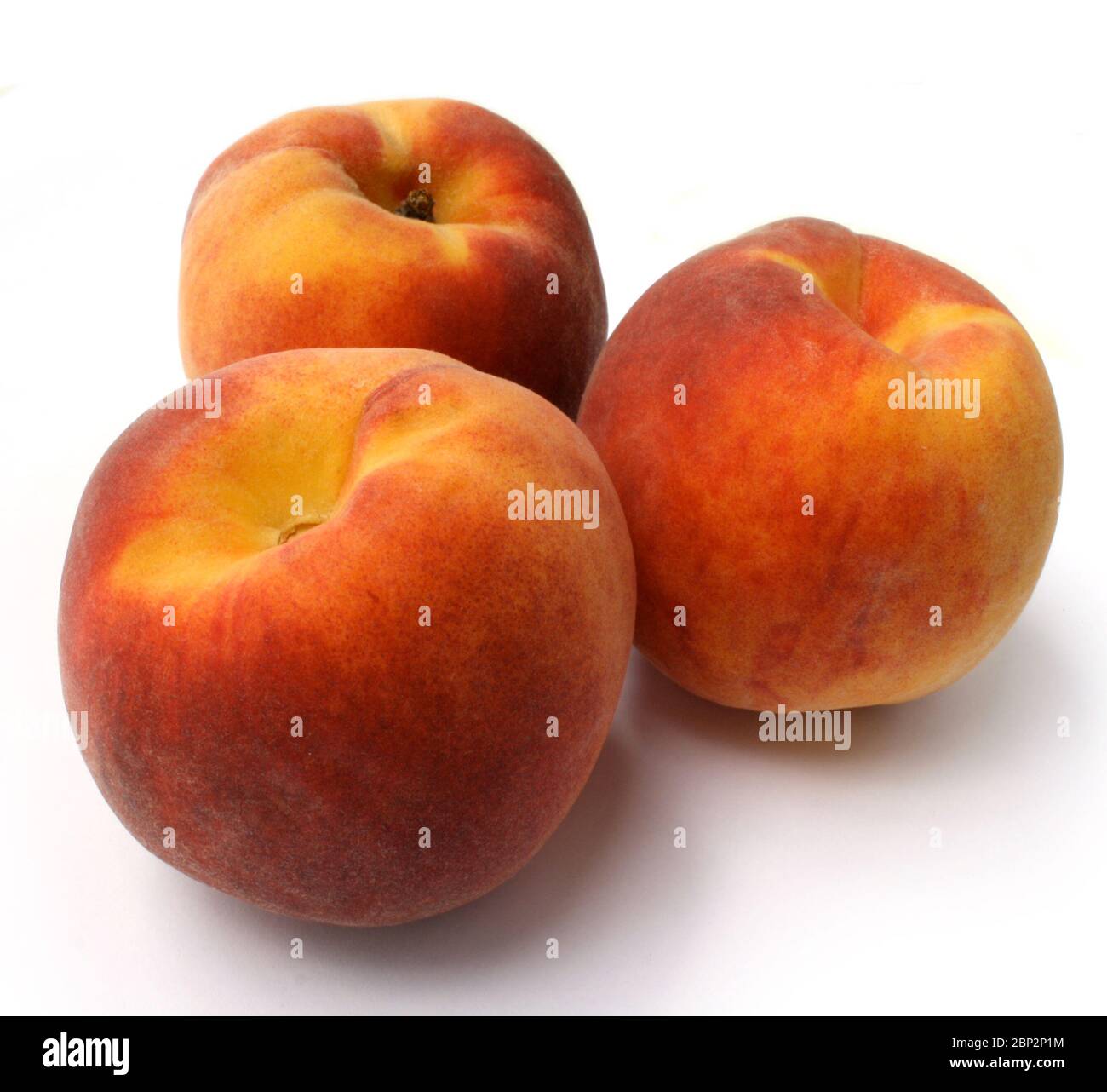 three fresh juicy peaches isolated over white Stock Photo - Alamy