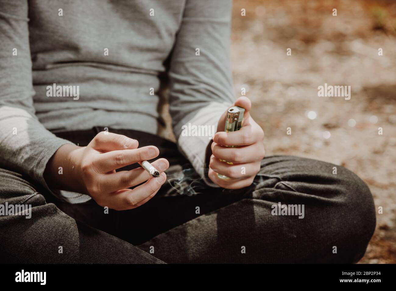 Health and social problem or issue concept, school young boy smoking ...