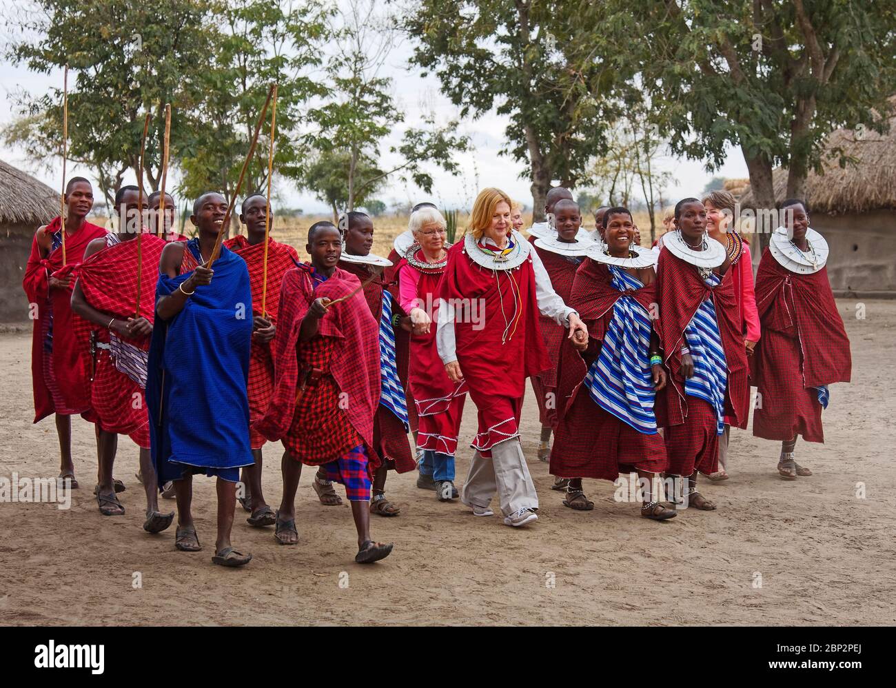 Maasai village; indigenous people; traditional dress, visitors, men ...