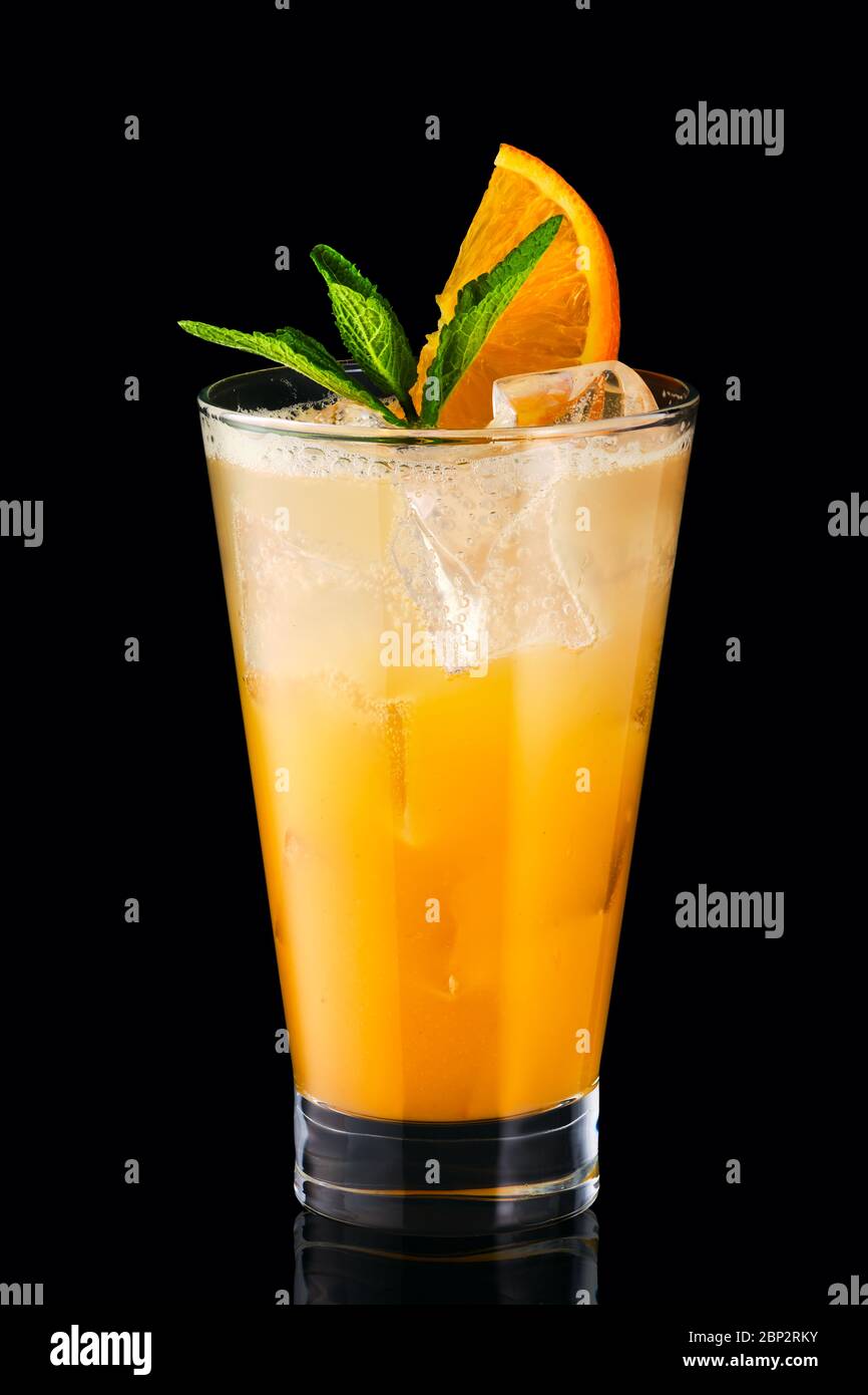 Cold fizz cocktail with orange isolated on black background Stock Photo ...