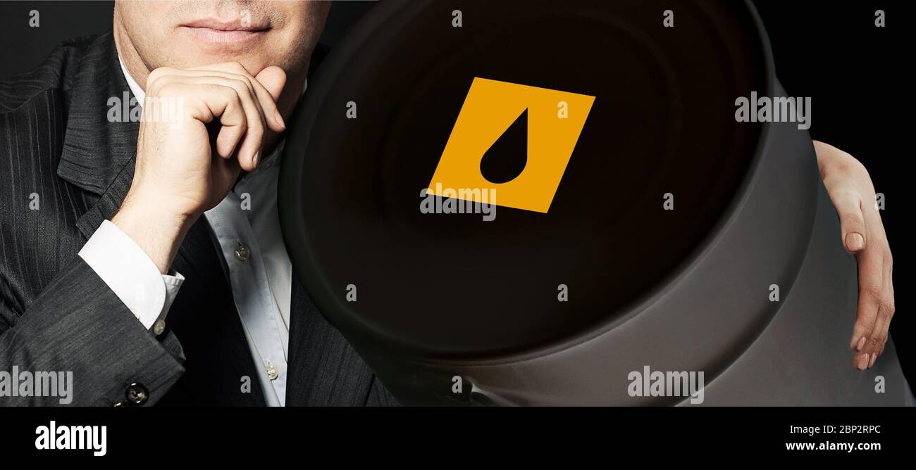 Man holding crude oil barrel on black background. Crude oil and ...