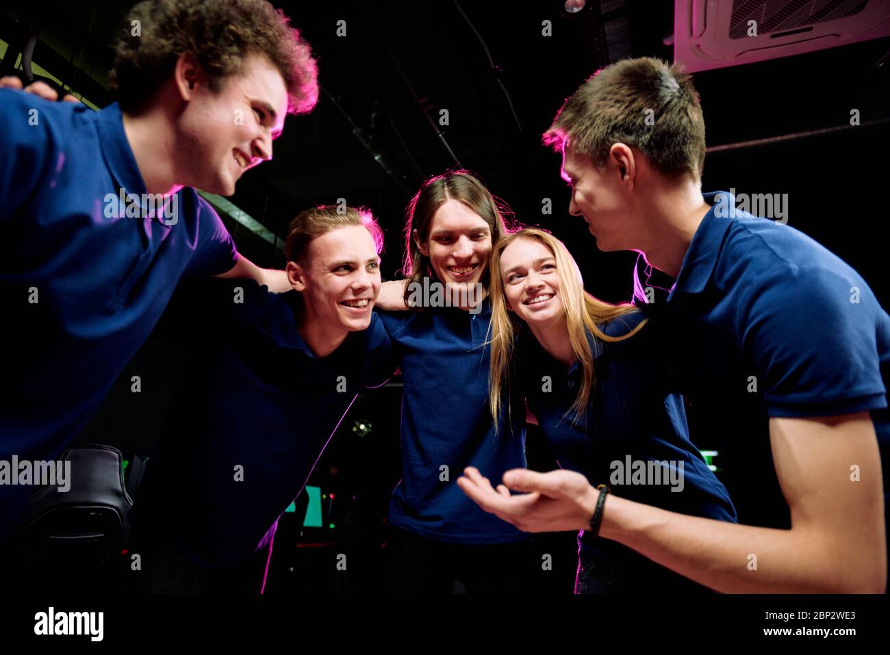 Winning standing embracing spectator sport stadium smiling hi-res stock ...