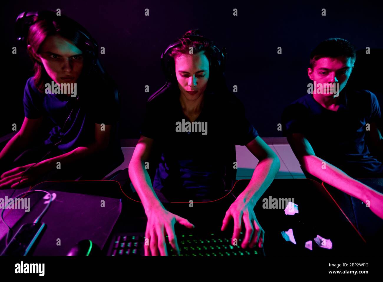 Group of young contemporary cybersports video gamers with headsets ...