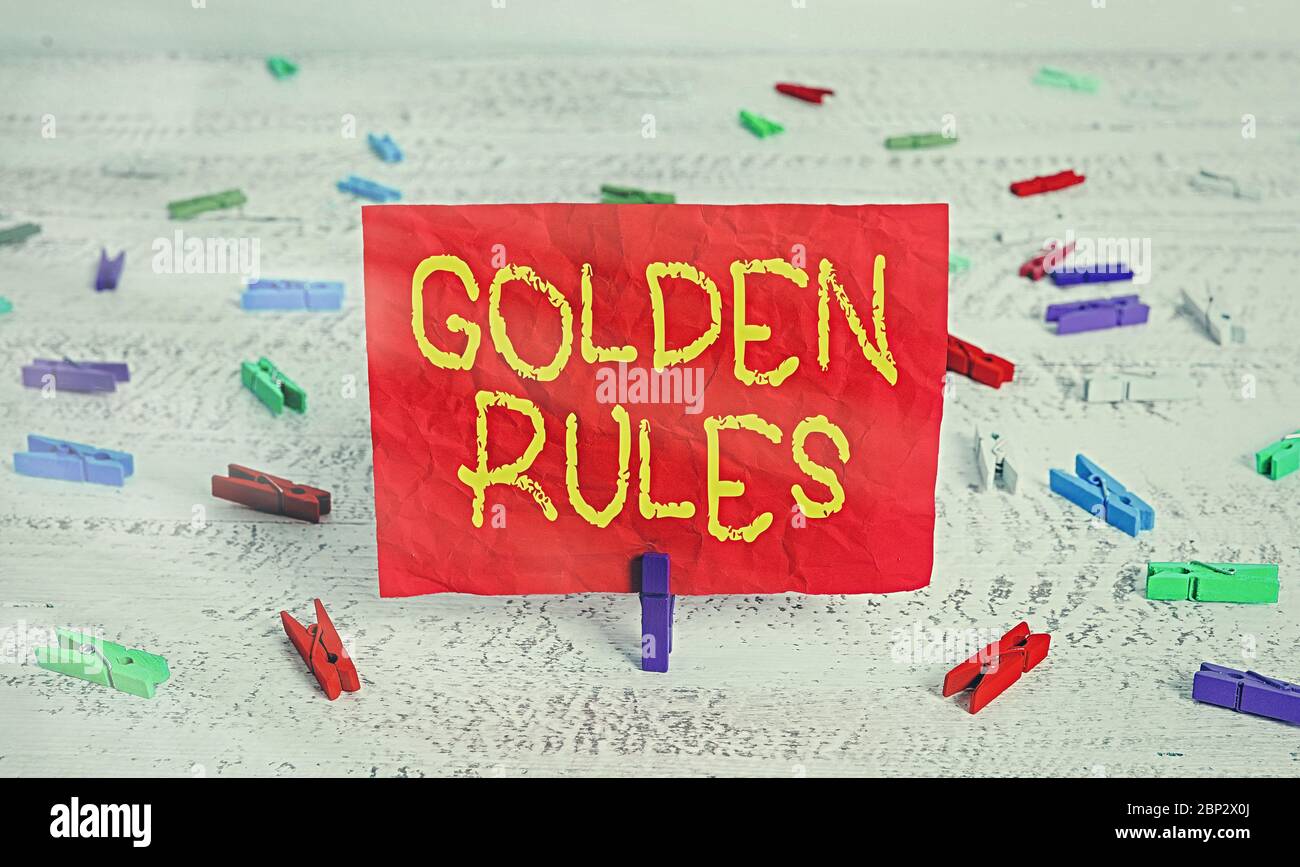 Writing note showing Golden Rules. Business concept for Basic principle that should be followed ...