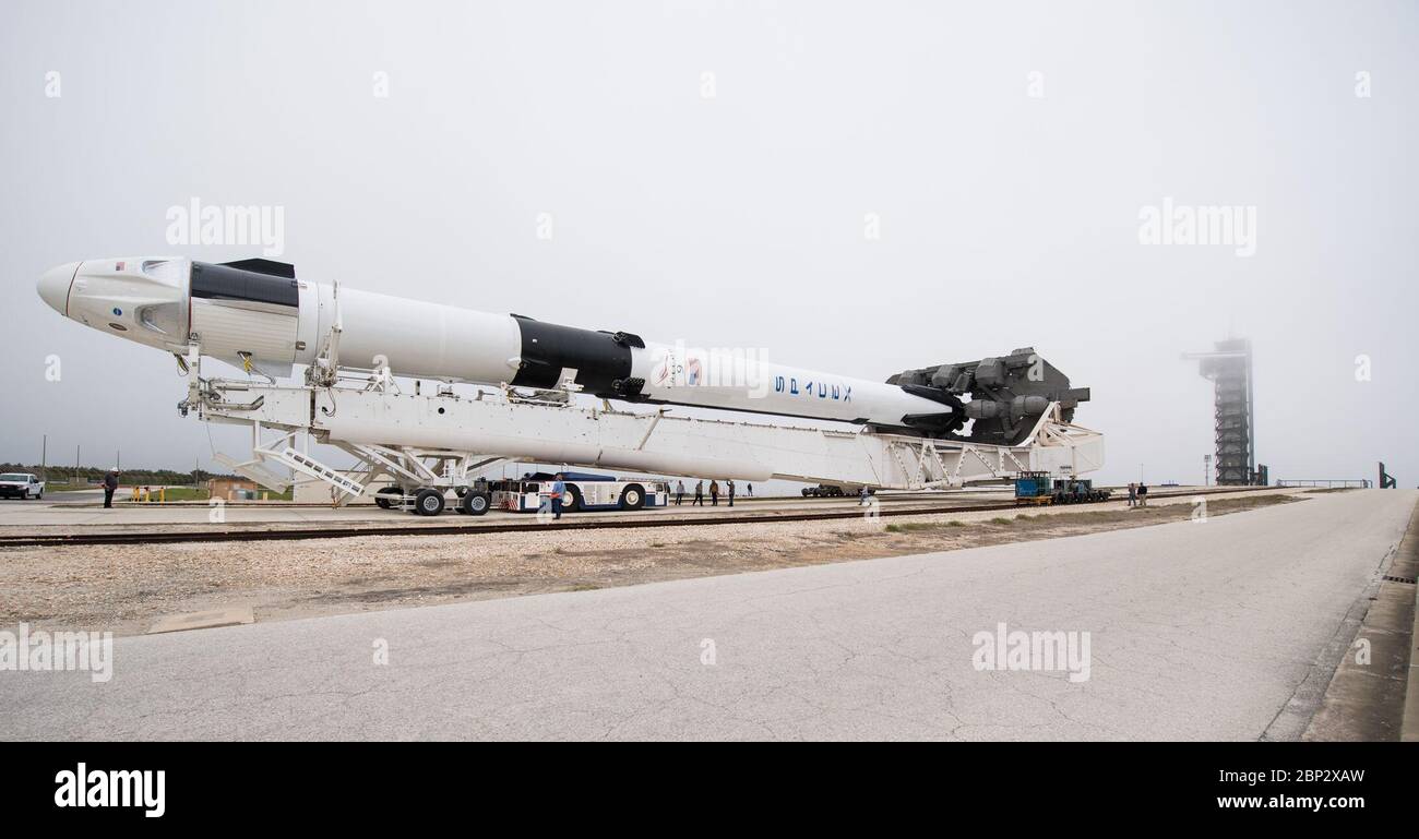 A SpaceX Falcon 9 rocket, carrying the Crew Dragon spacecraft, is ...