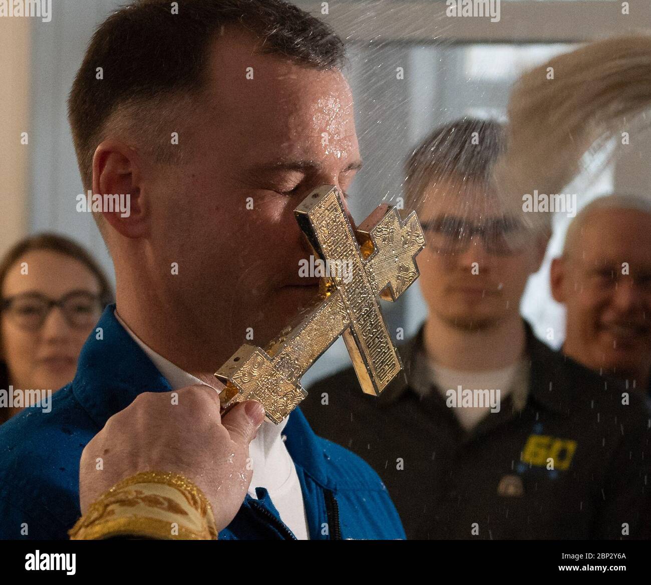 On March 14, 2019, astronaut Nick Hague of NASA receives a blessing ...
