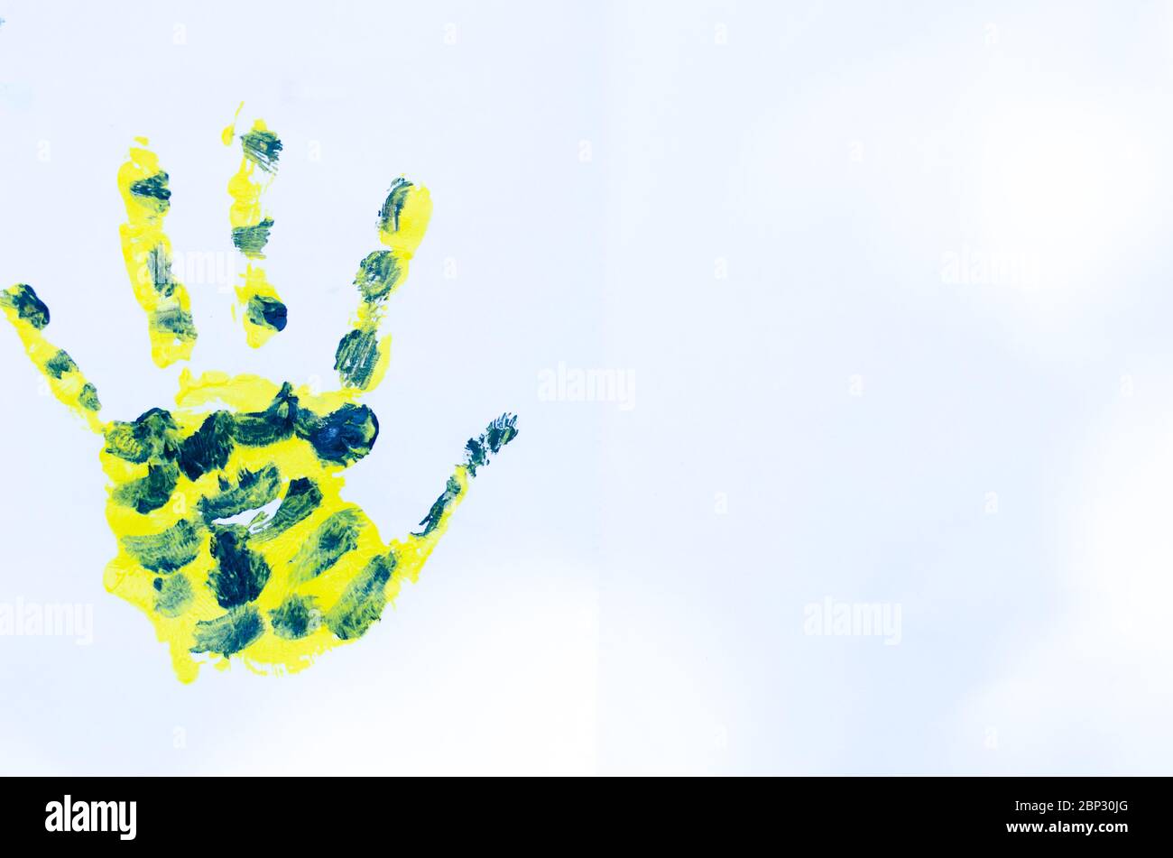 colorful yellow and blue hand print isolated Stock Photo - Alamy
