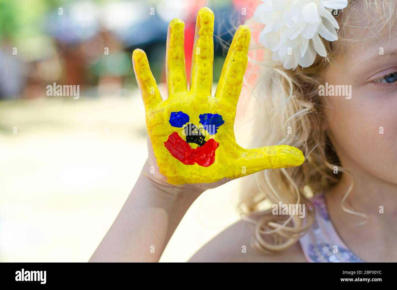 happy smiling child with colorful image on her hand and fingers Stock ...