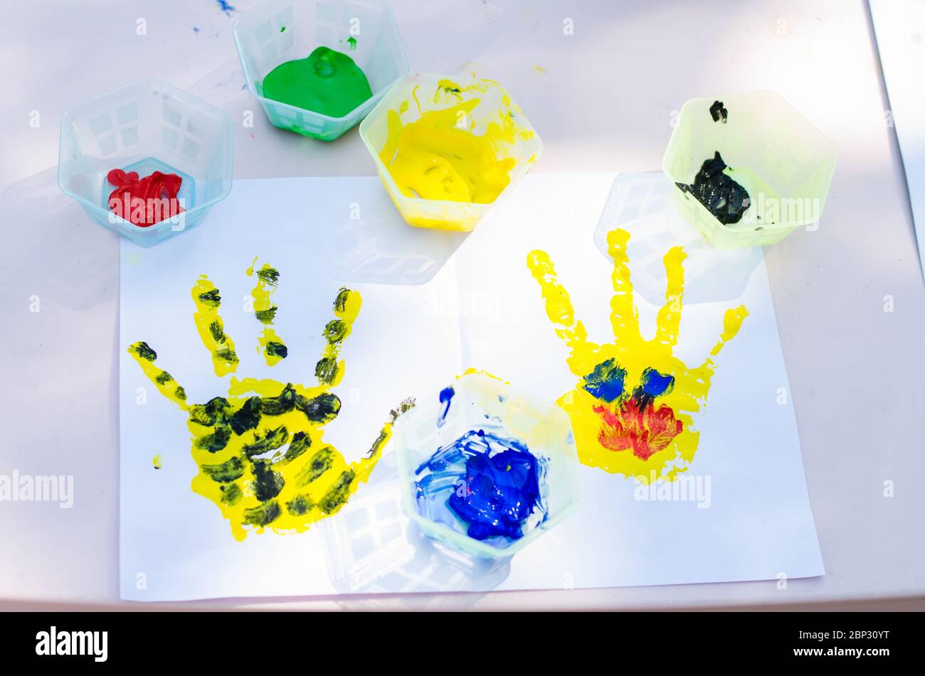 colorful yellow and blue hand print isolated Stock Photo - Alamy