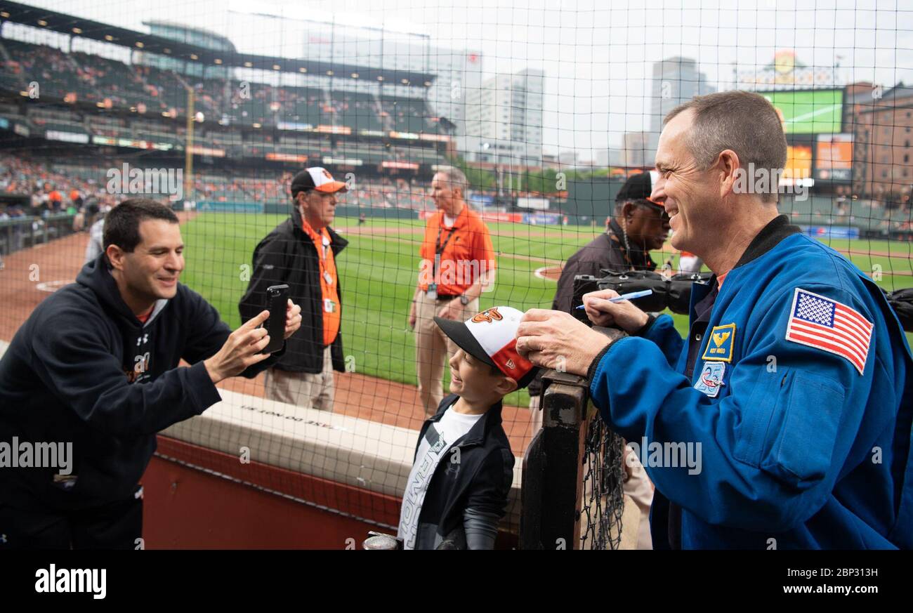 NASA astronaut Ricky Arnold, a Maryland native, takes a photo with a ...