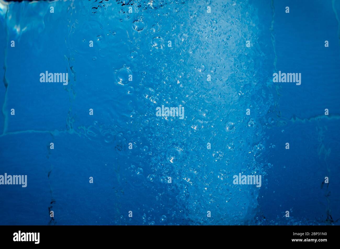 clean blue swimming pool with bubbles Stock Photo - Alamy